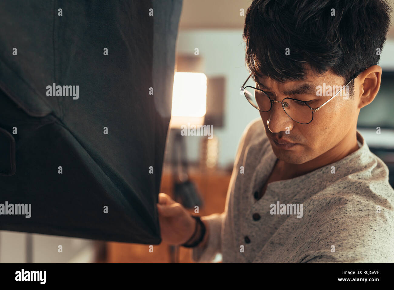Adjusting light hi-res stock photography and images - Alamy