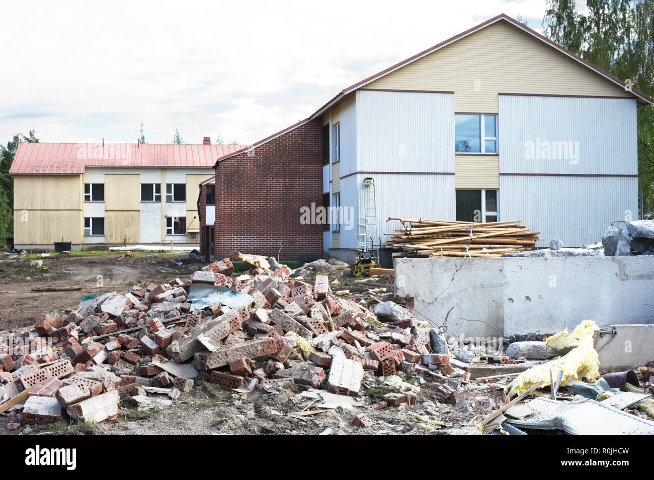 Pile of brick debris at a building demolition site. Construction waste ...