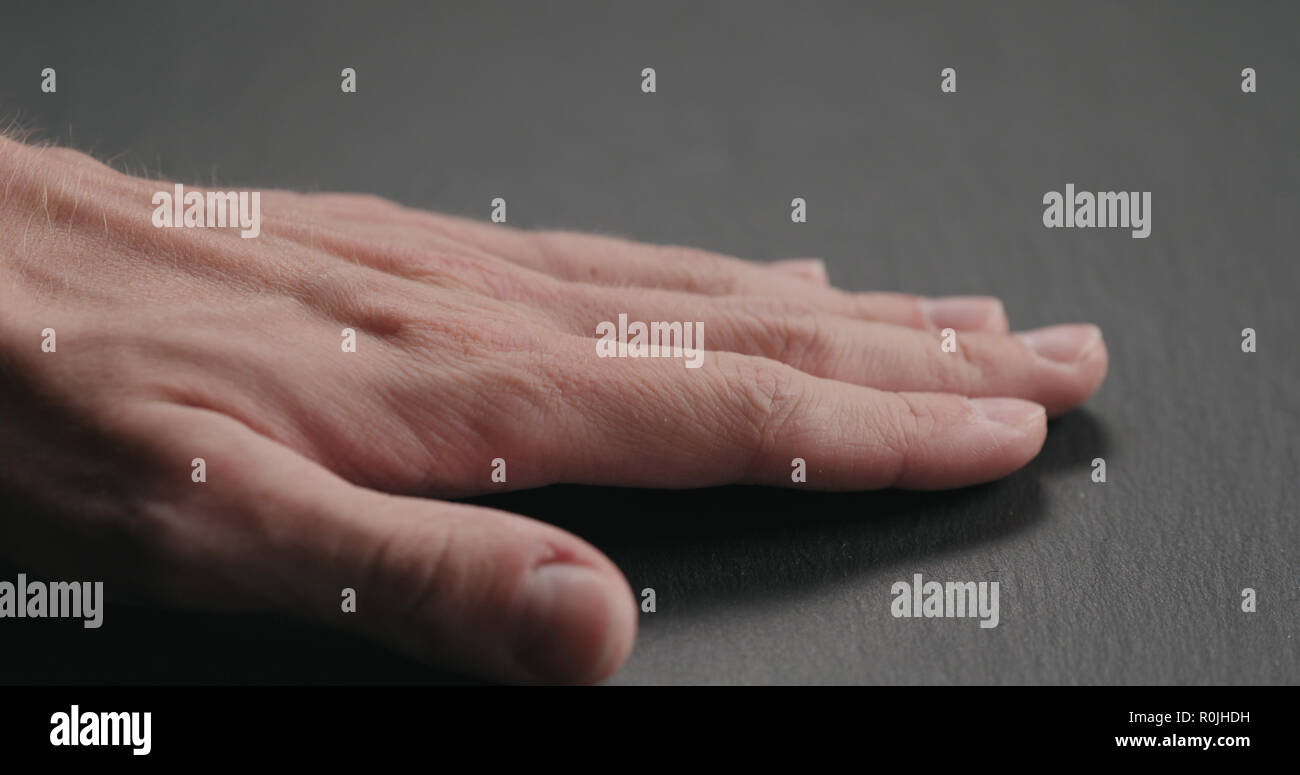man hand check quality of slate stone surface, wide photo Stock Photo ...