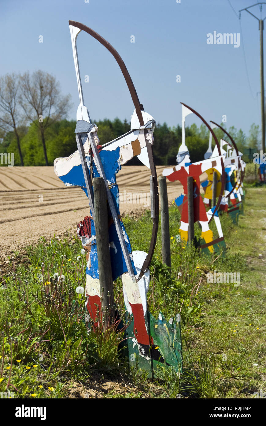 Colorfully painted wood archers stand on the battlefield of Agincourt ...