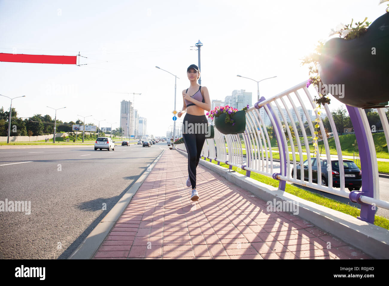 Beautiful woman running over bridge hi-res stock photography and images ...