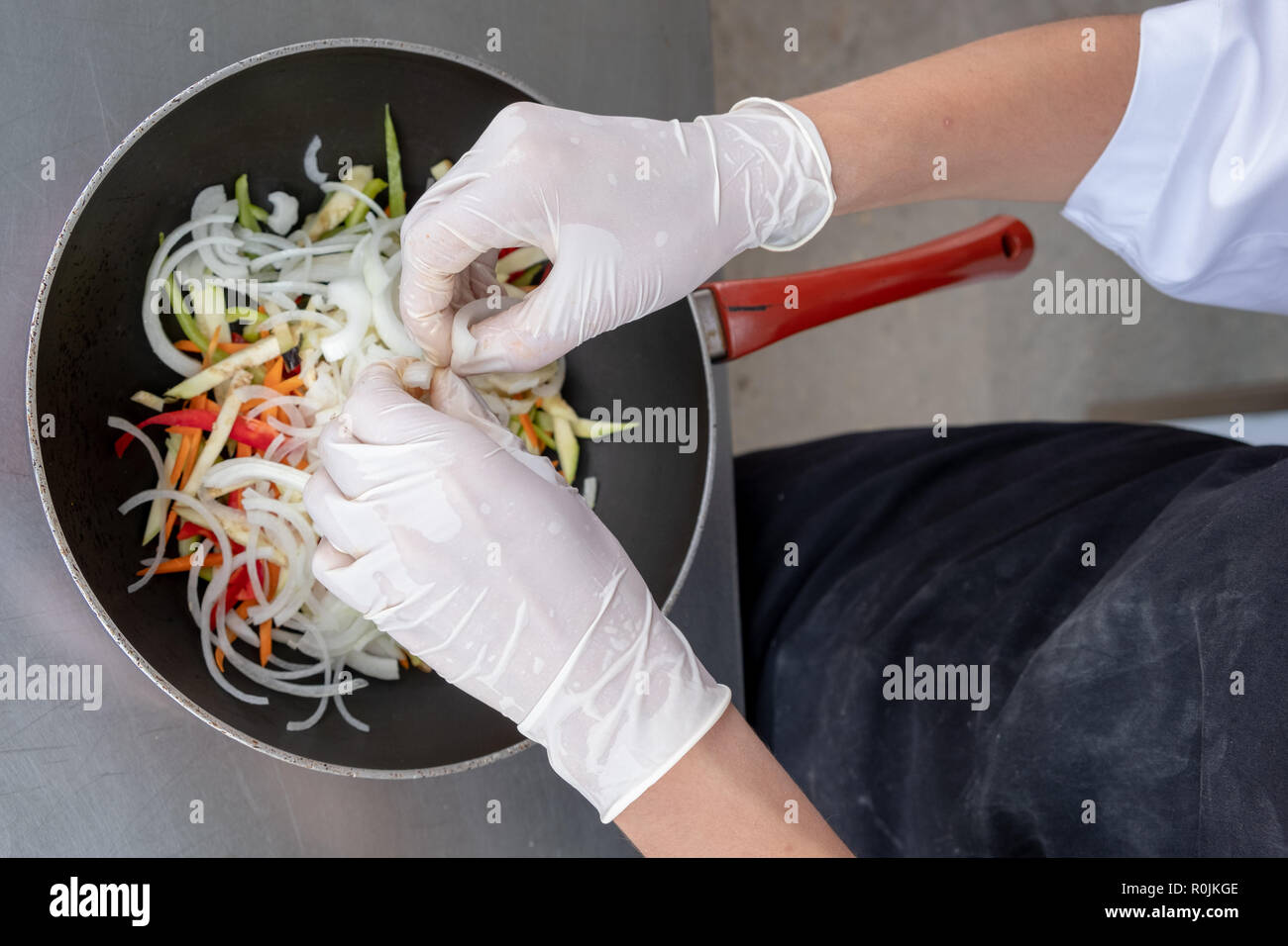 Chef in hotel or restaurant kitchen cooking only hands Stock Photo - Alamy