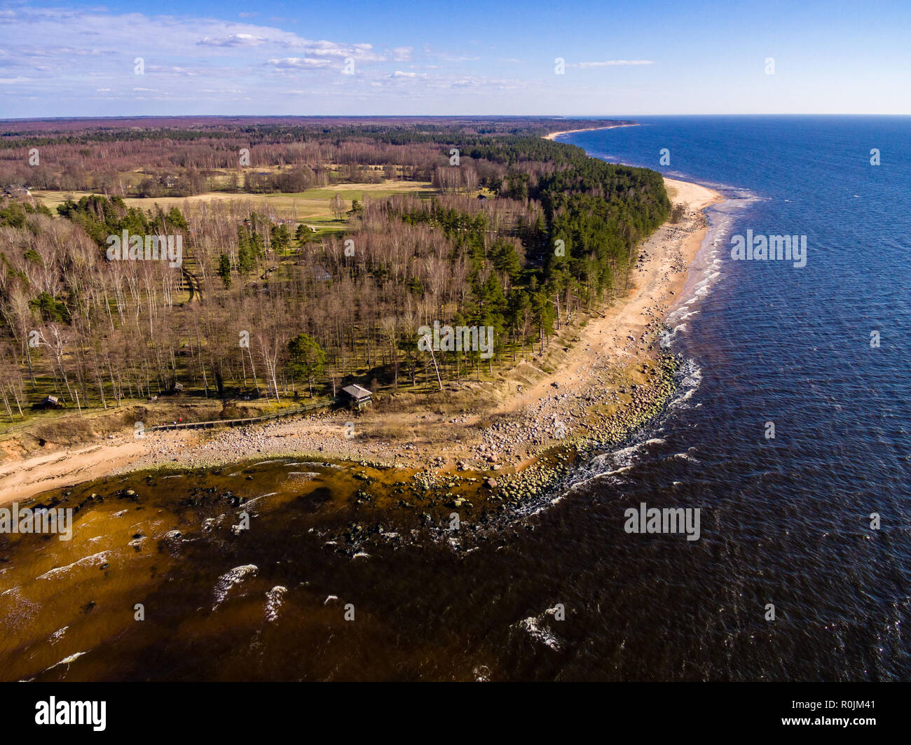 drone image. aerial view of rural area with rocky beach of Baltic sea ...
