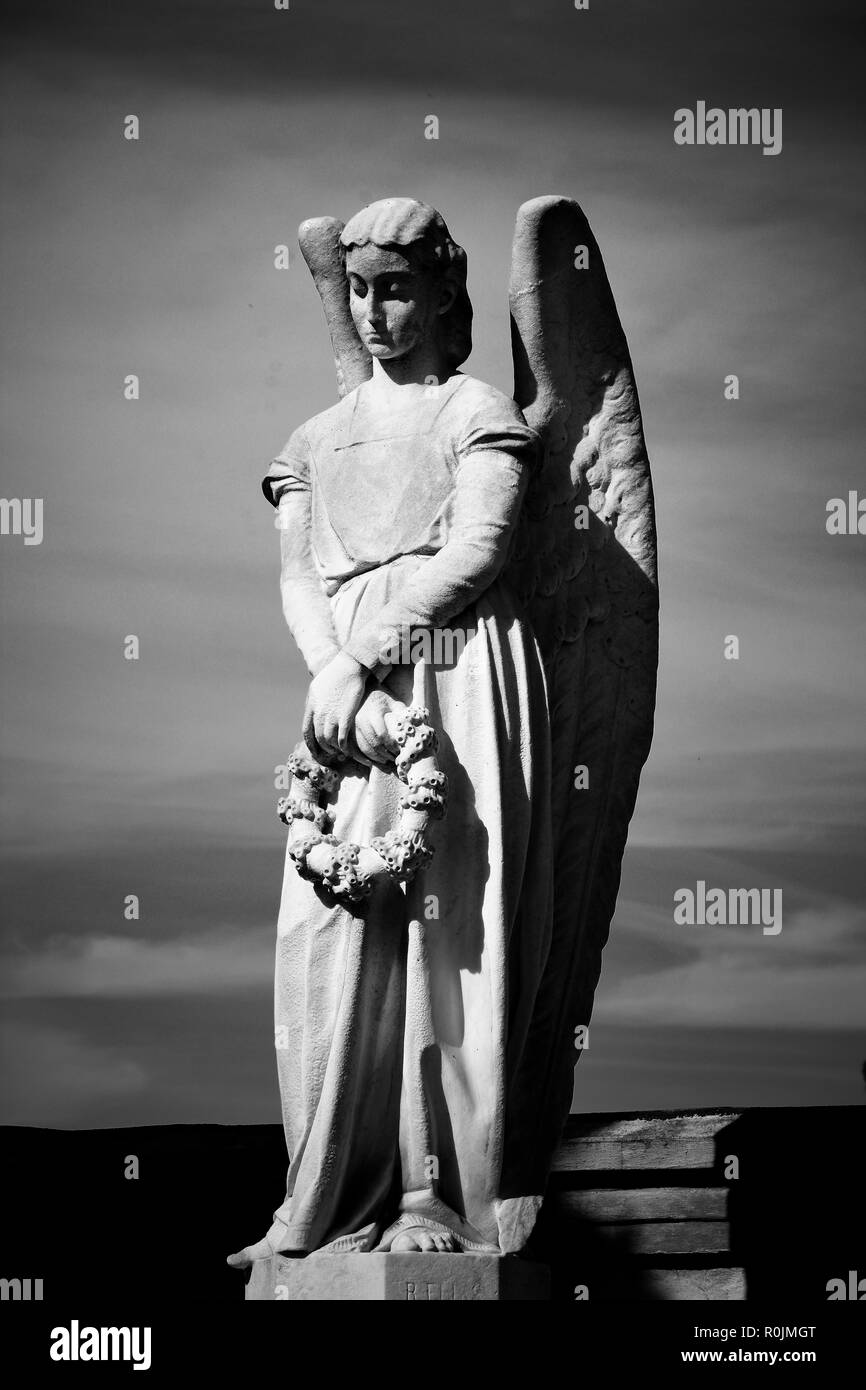 Angel stone ancient statue cemetery praying Black and White Stock ...