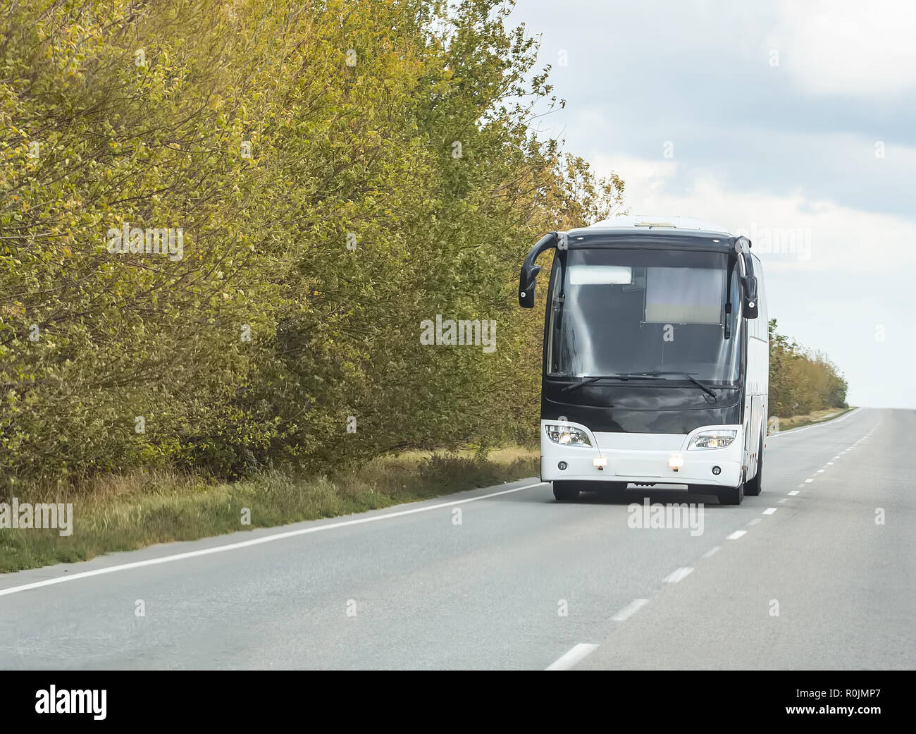tourist bus goes on the highway in the summer Stock Photo - Alamy