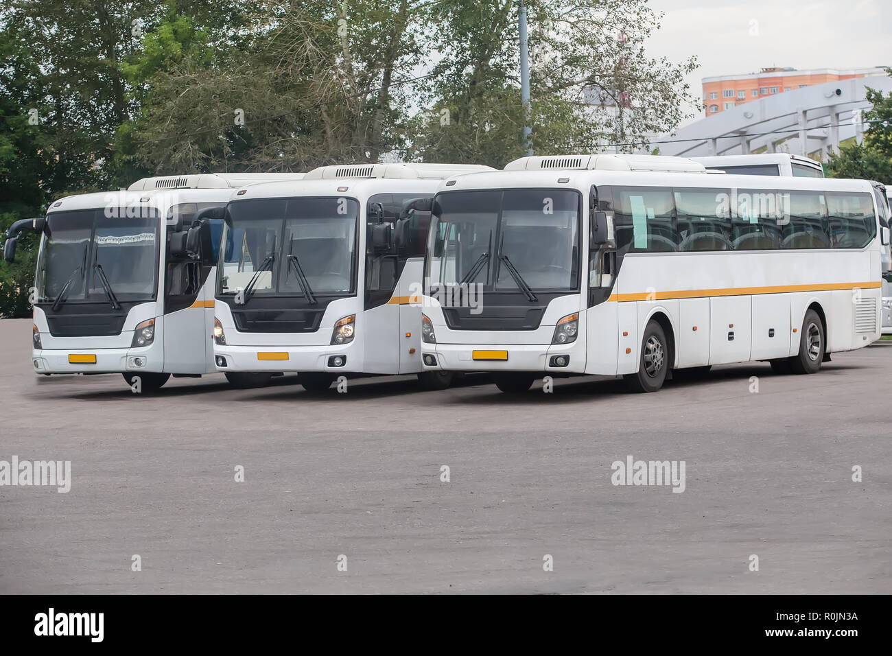 big tourist buses on parking Stock Photo - Alamy
