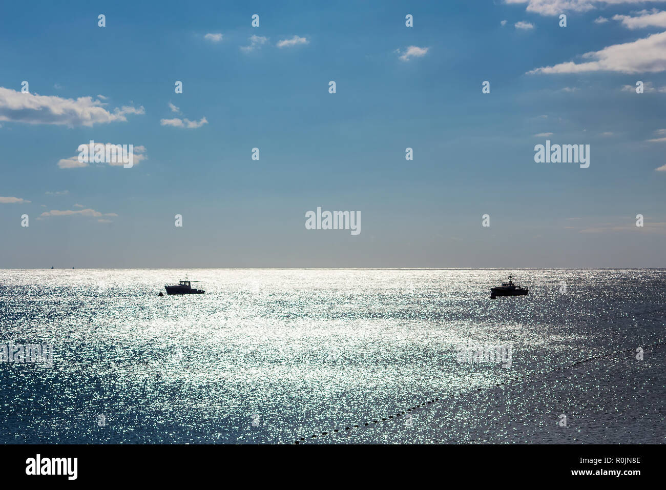 Two boats in a sea at night. Calm sea. Moonlight Stock Photo - Alamy