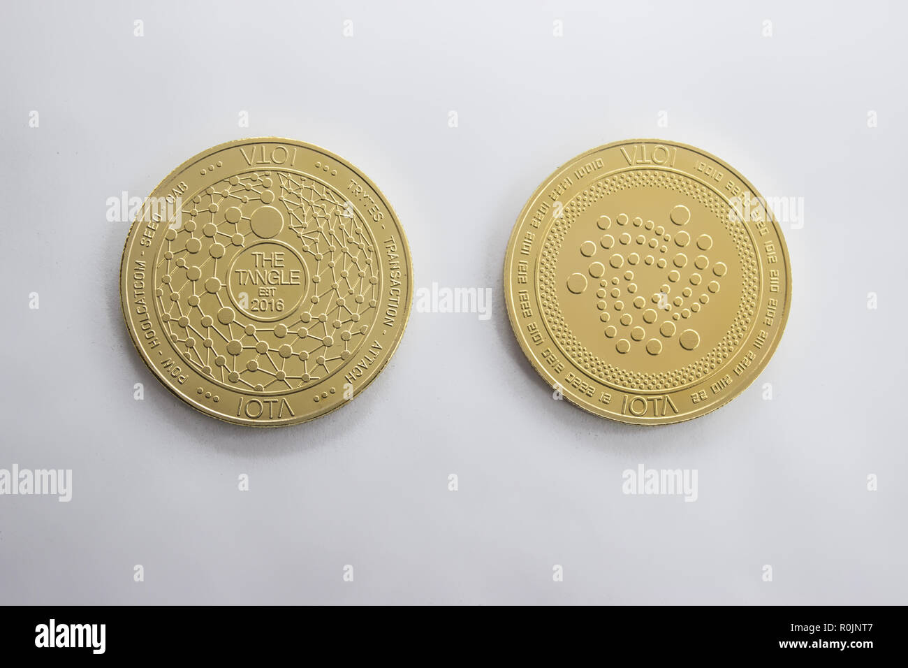 On a white background is isolated the front and back side of gold coin ...