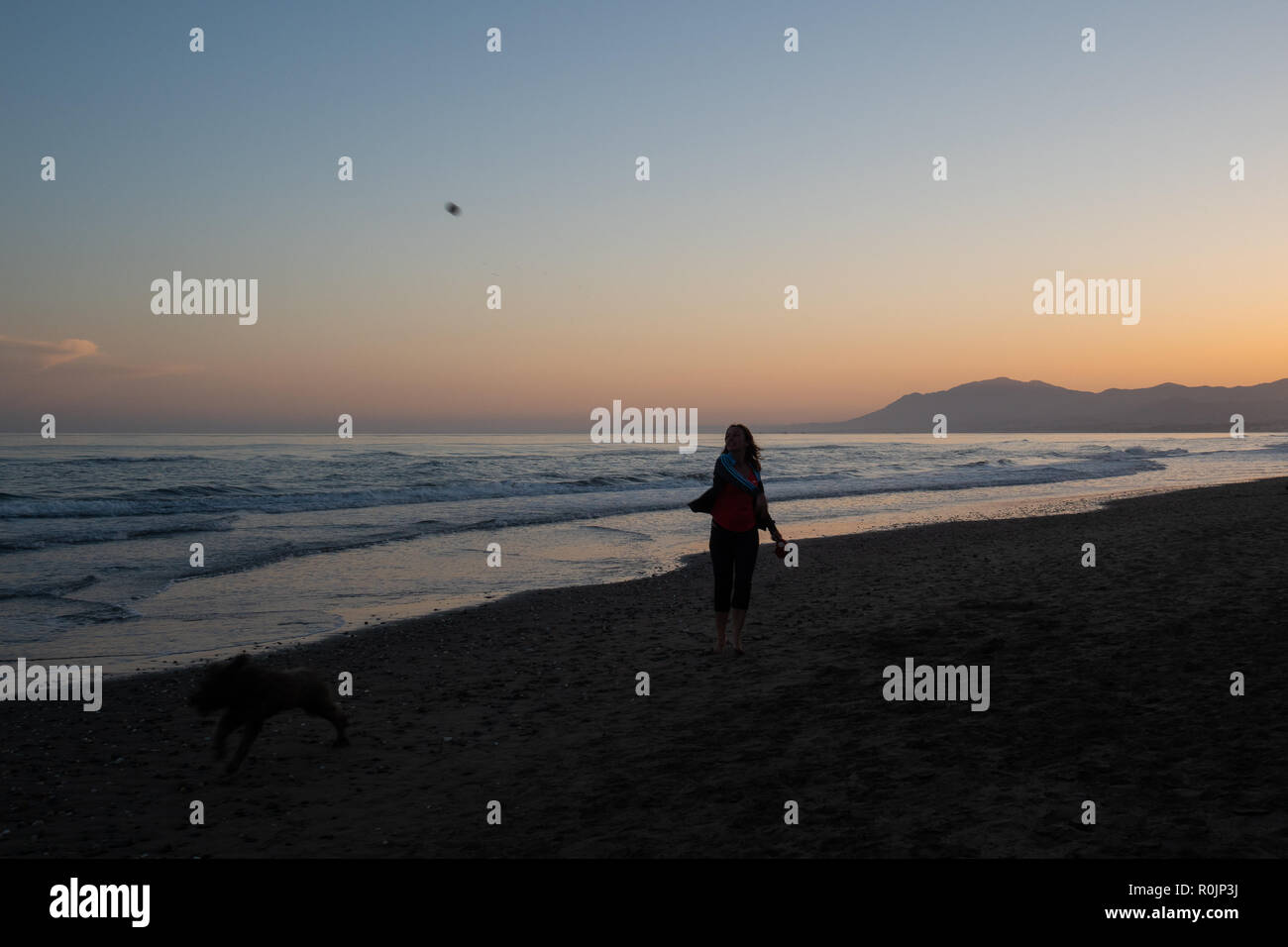 Beach sunset in Marbella, Spain Stock Photo - Alamy