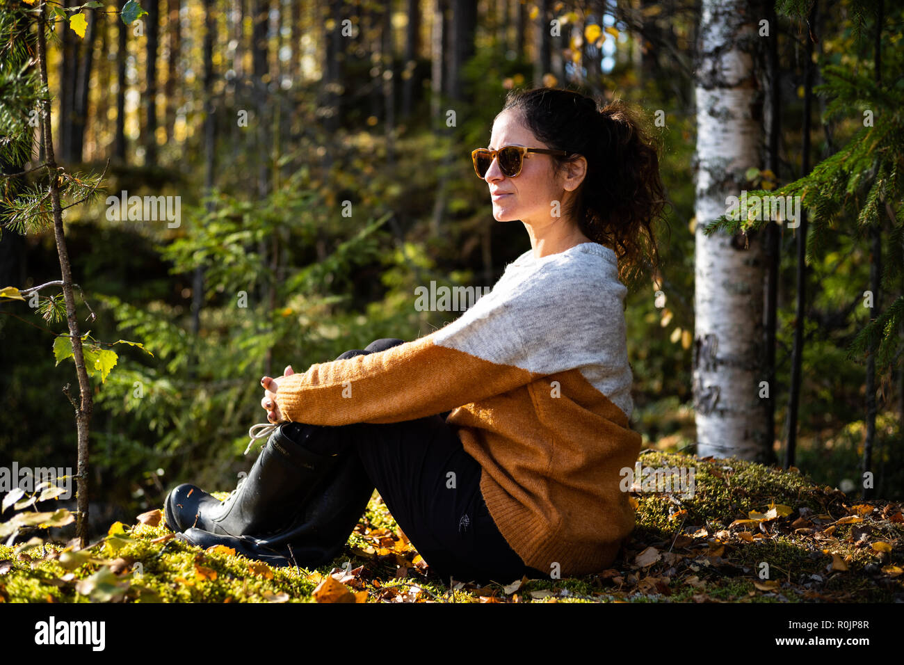 Girl in the forest wearing knit sweater hi-res stock photography and ...