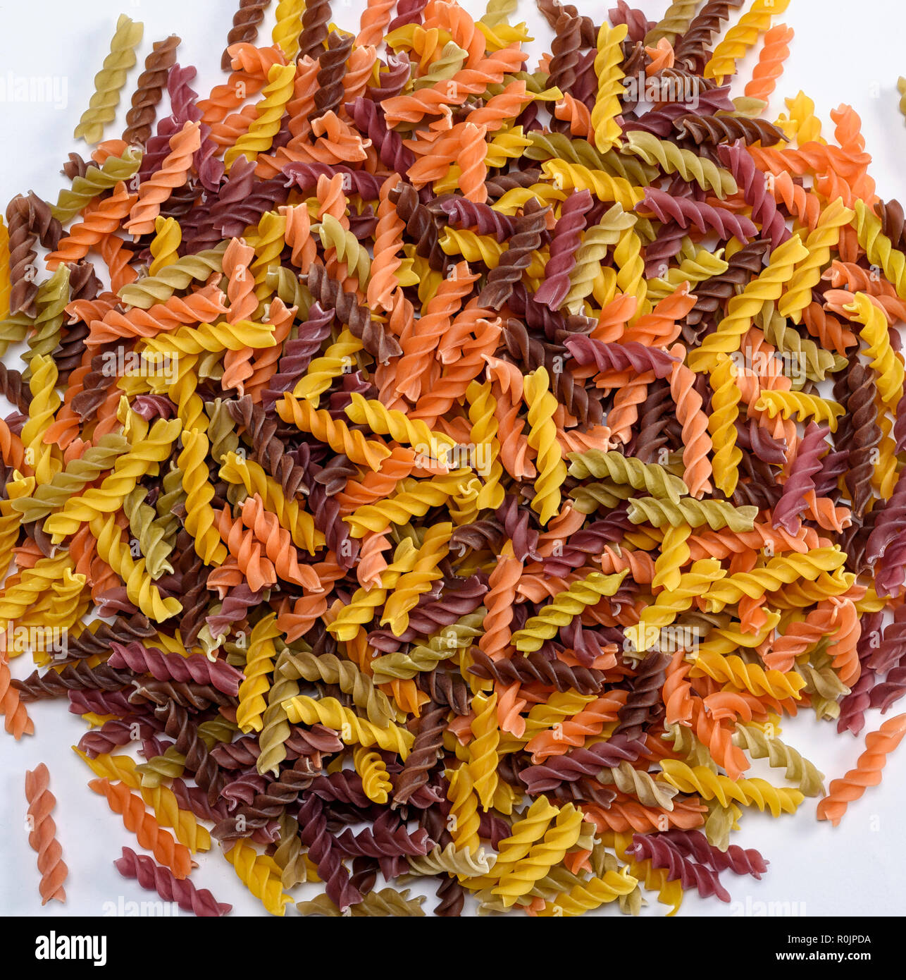 uncooked pasta colorful spiral fusilli made from wheat flour durum on a ...