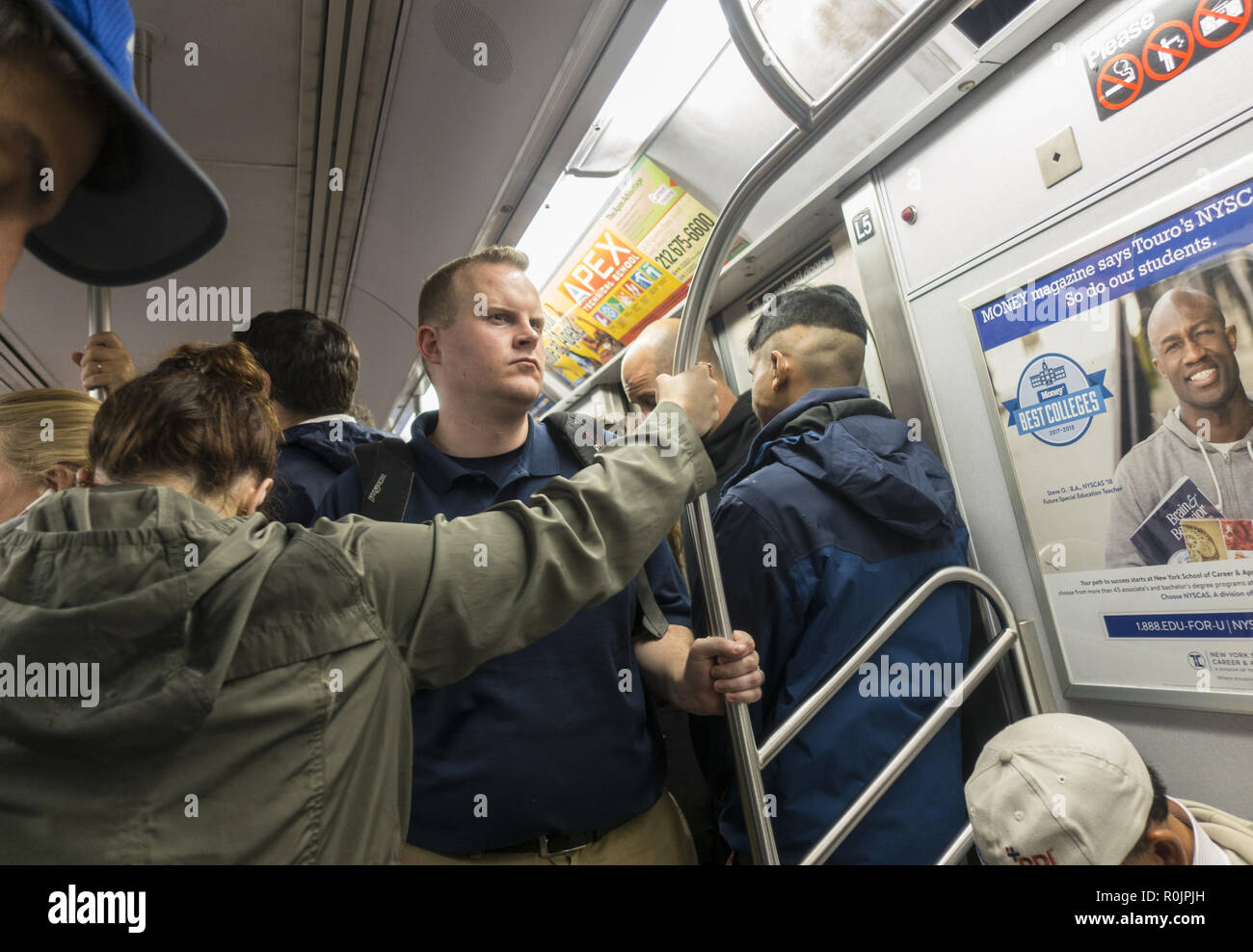 People riding an uptown New York City subway train in Manhattan Stock ...