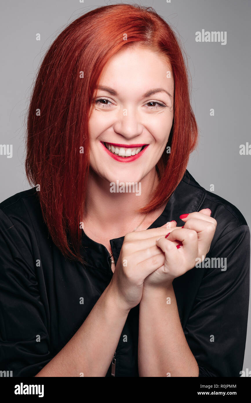 portrair of charming woman smiling and looking at camera Stock Photo ...
