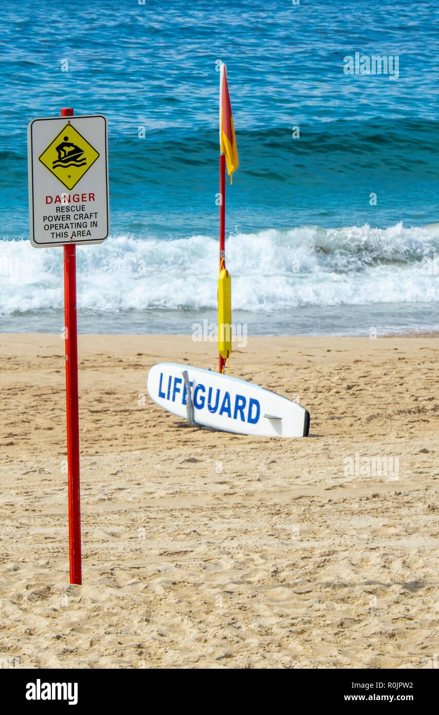 Lifeguard surfboard and warning sign at Coogee Beach Sydney NSW ...