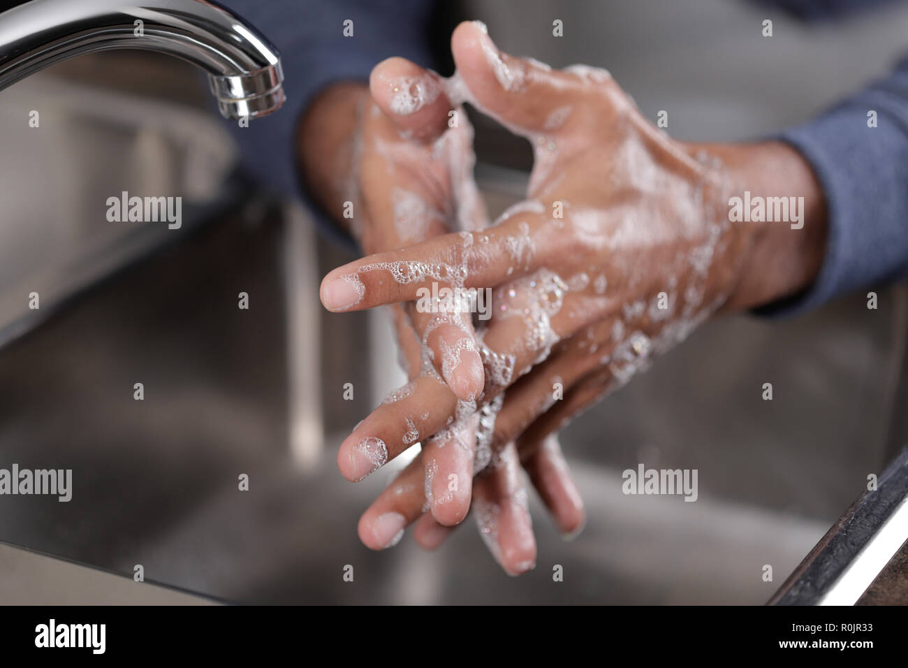 Washing hands with soap and water at the faucet, Hygiene concept Stock ...