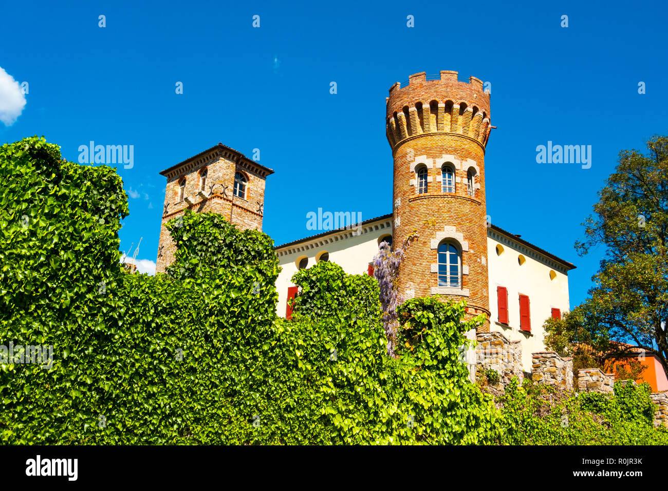 Buttrio castle brick tower seen from outide the perimeter crenellated ...