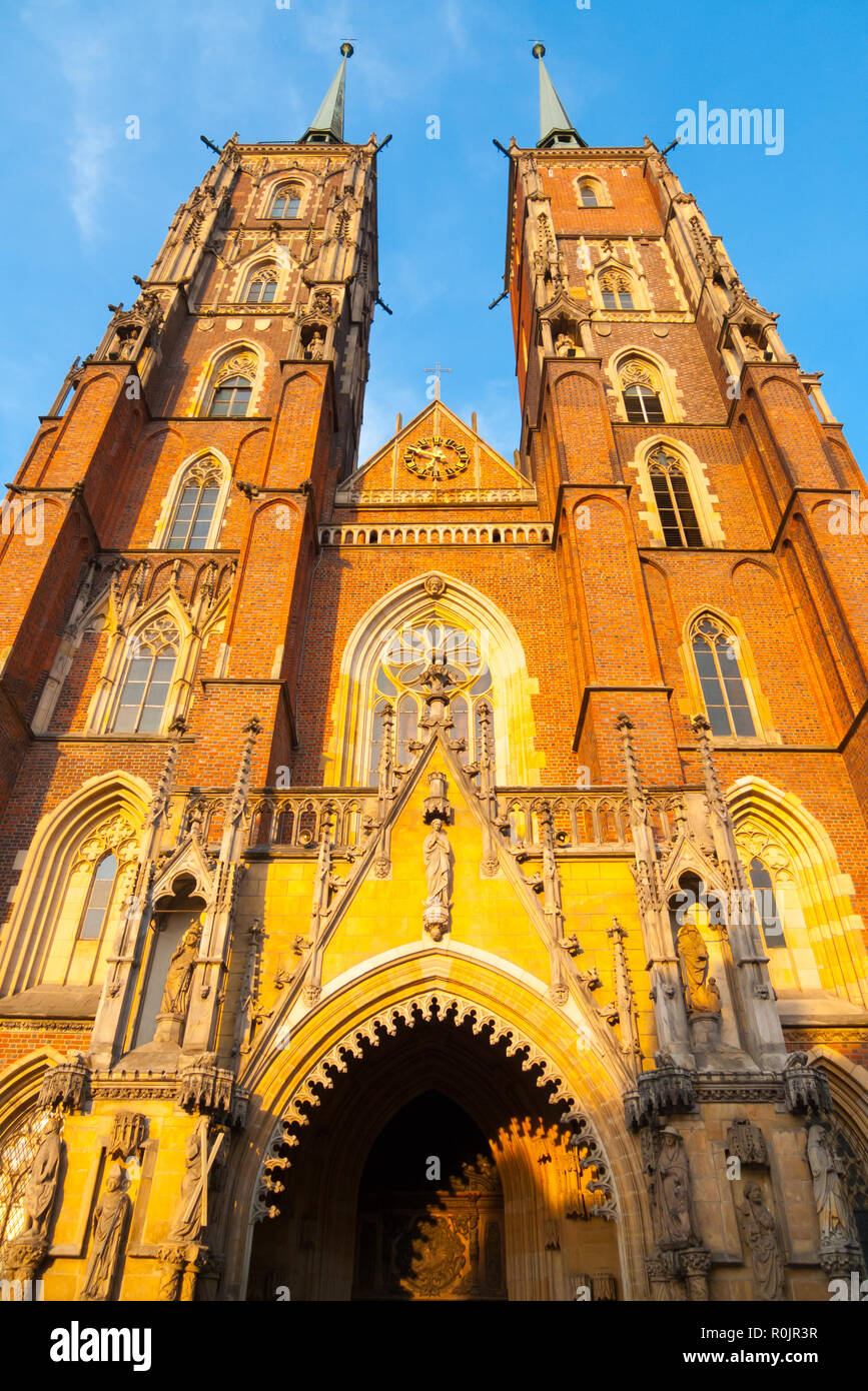 Vertical front view of the facade of St. John the Baptist cathedral at sunset in Wroclaw, Lower ...