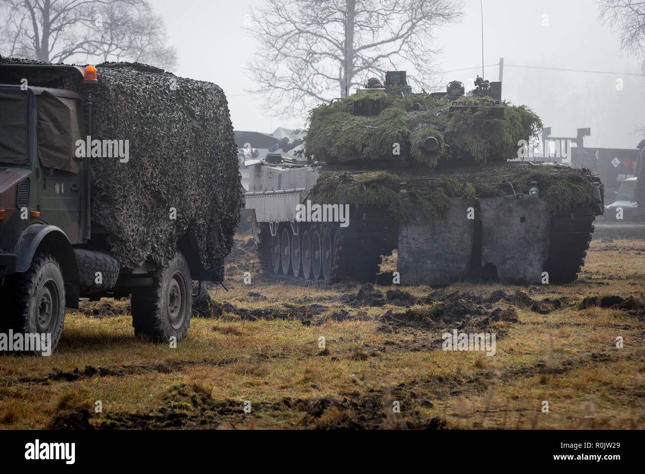 German main battle tank Leopard 2 securing the assembly area of the ...