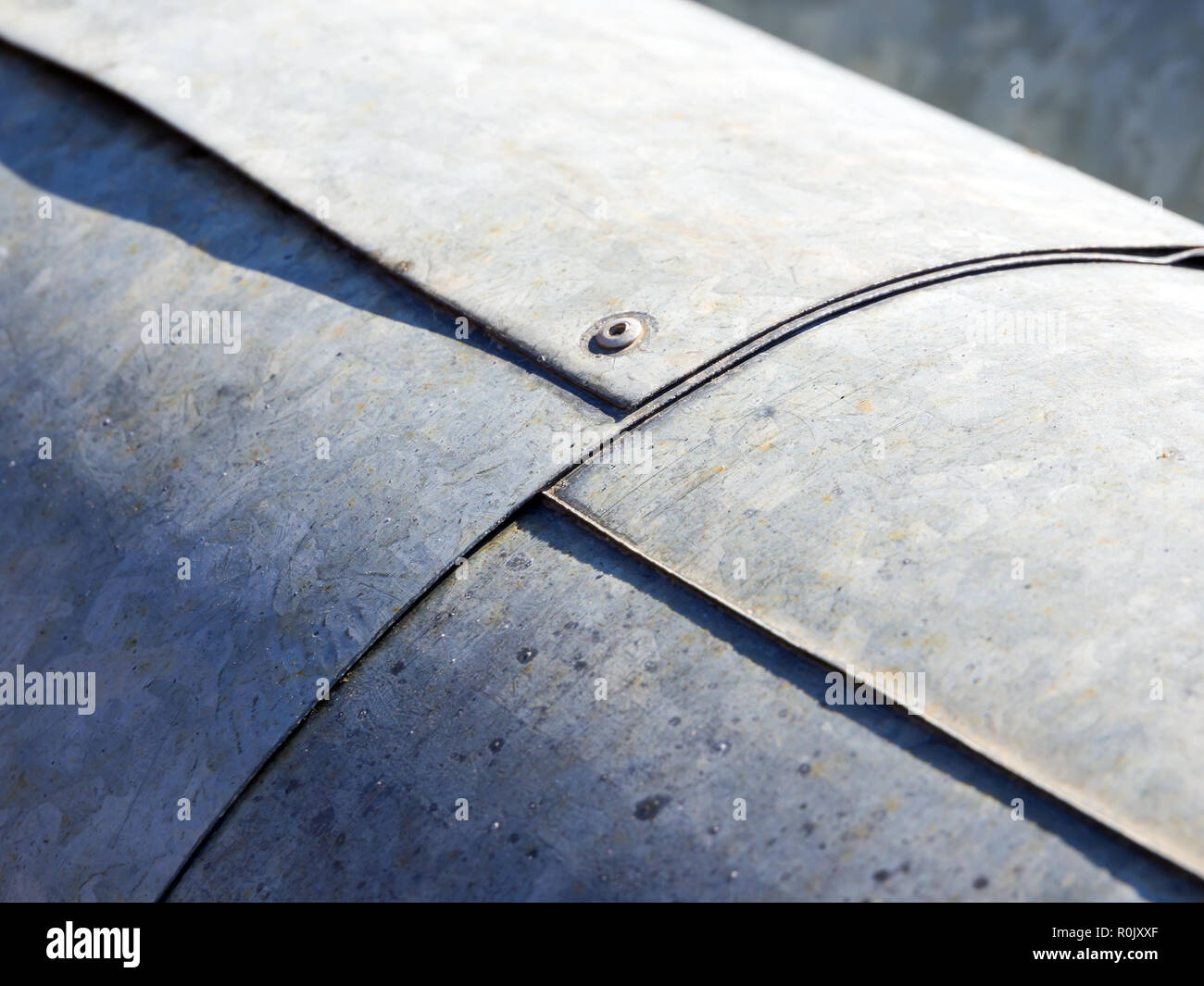 Sheathing of heat supply pipe from galvanized metal sheets Stock Photo ...