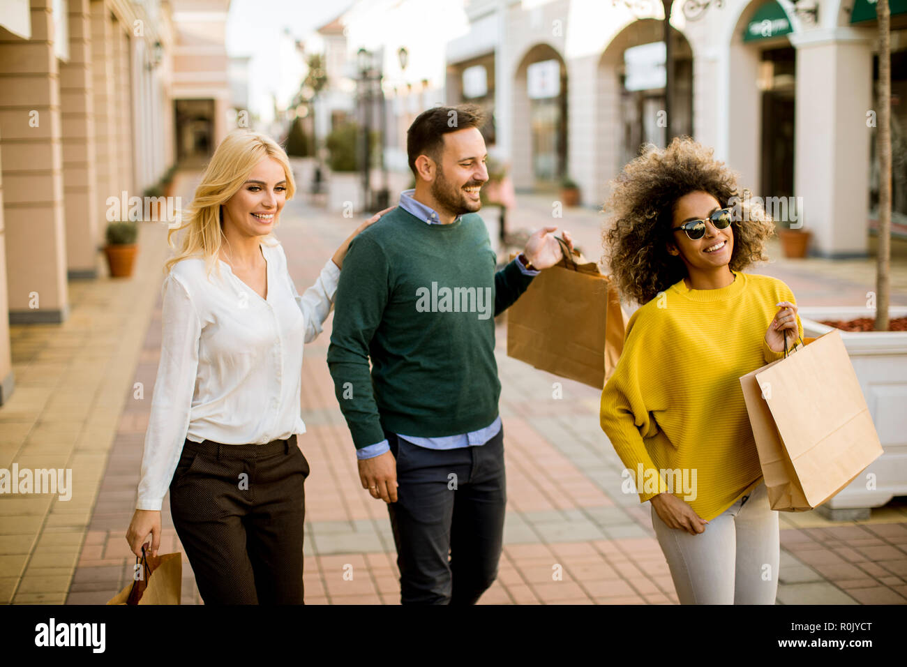 Group of young multiracial friends shopping in mall together Stock ...