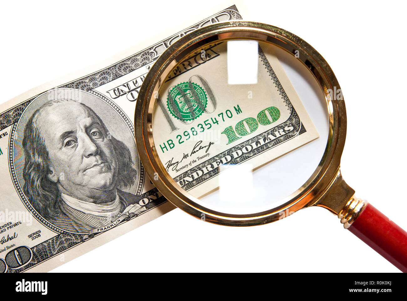 magnifying glass with dollar bill Stock Photo - Alamy