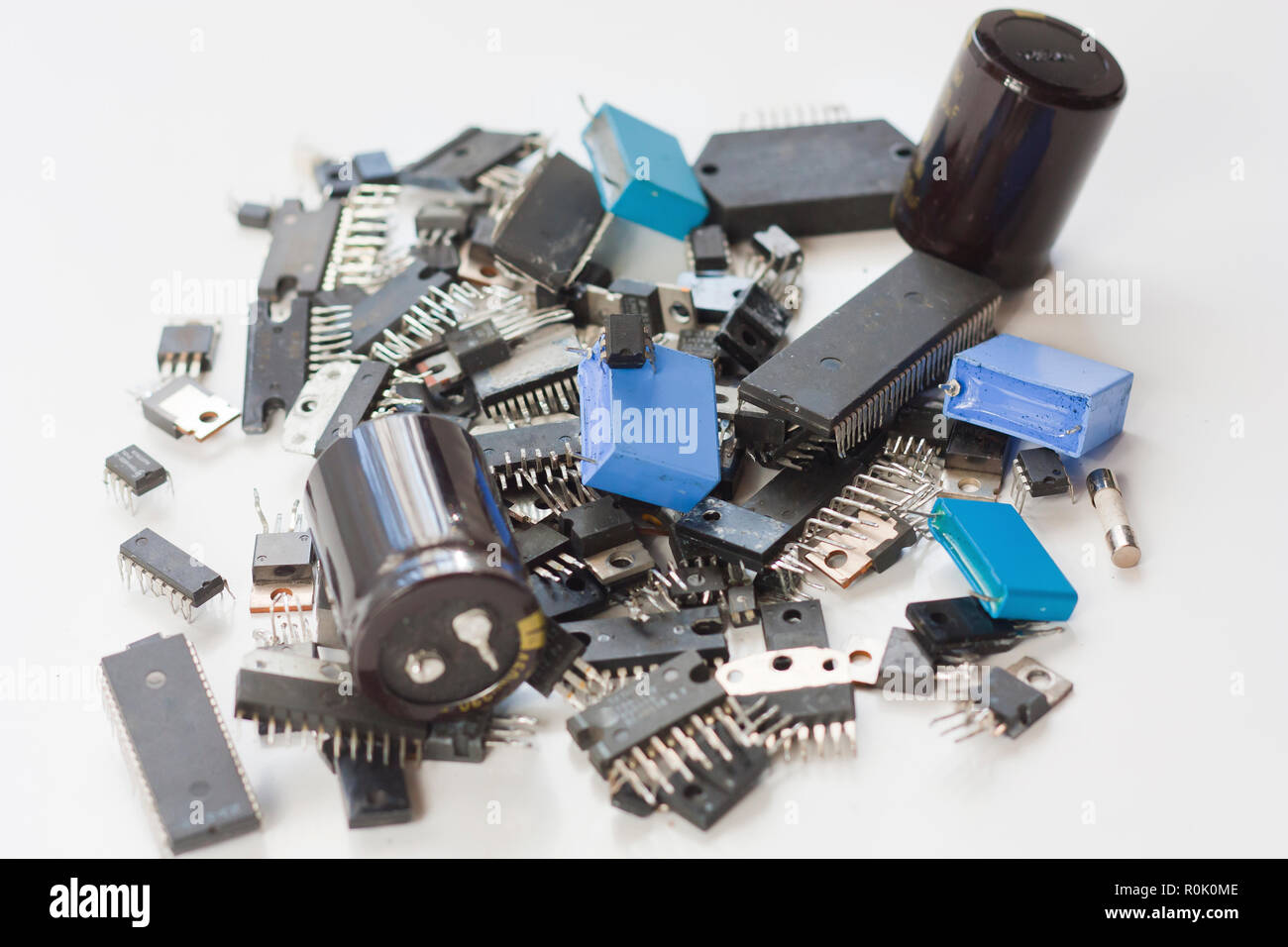 Pile of electronic components on white background Stock Photo - Alamy