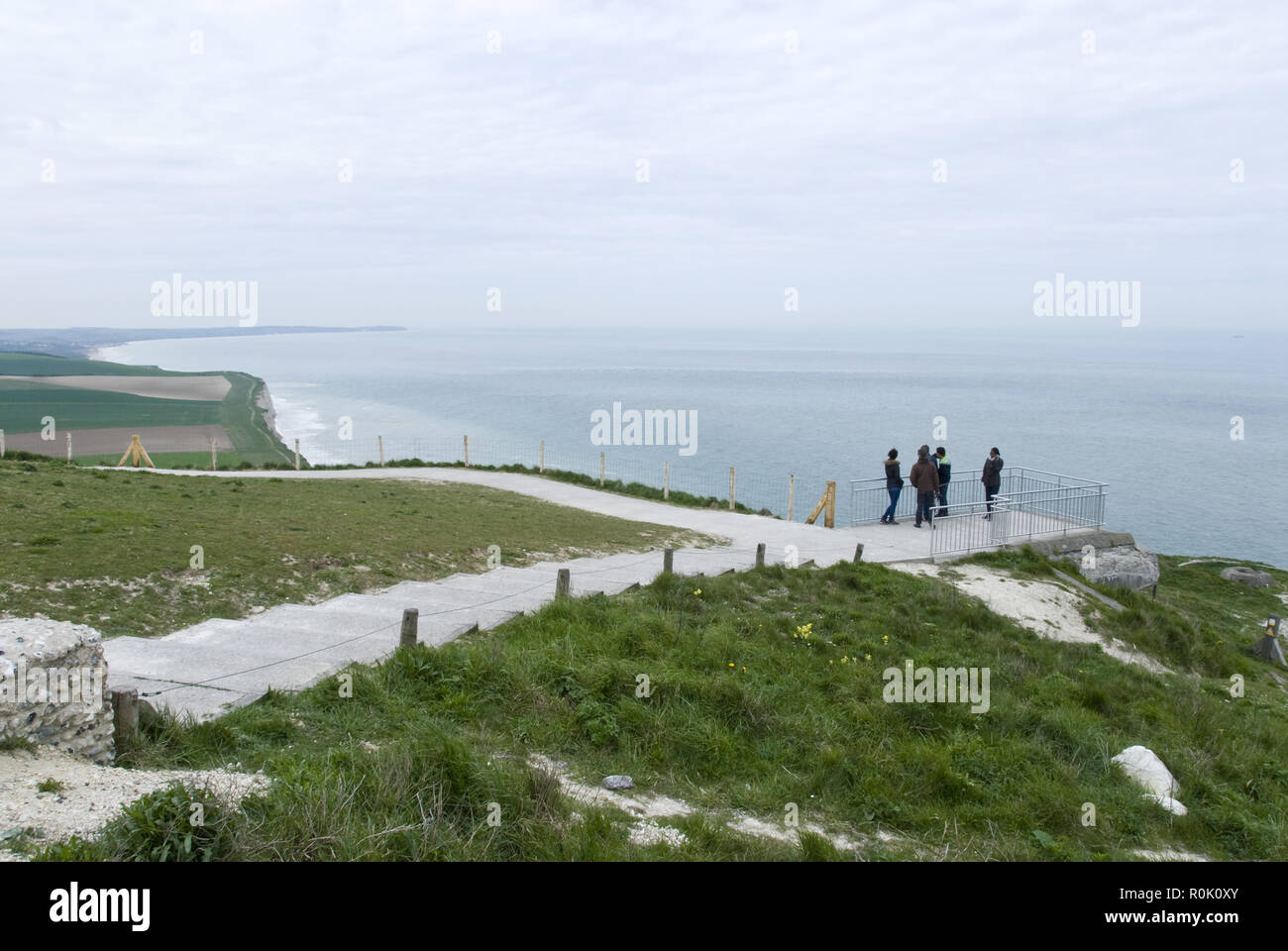 Tourists look across the English Channel from viewpoints atop the ...