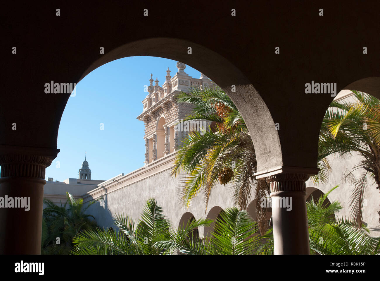 View on the palm garden and palace tower through the arches of the ...