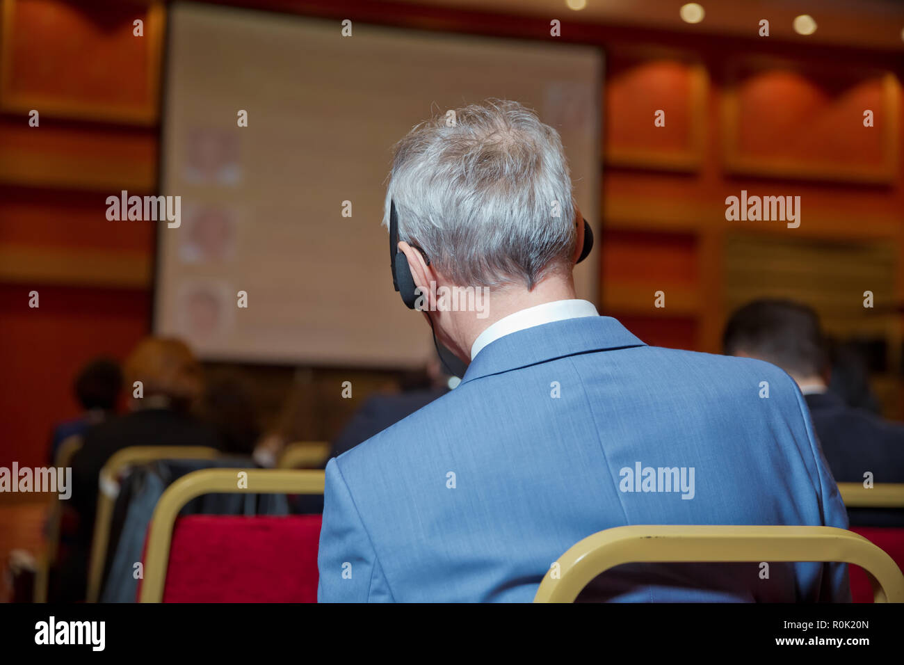 bald security guard with the headset to control people . heated debate ...