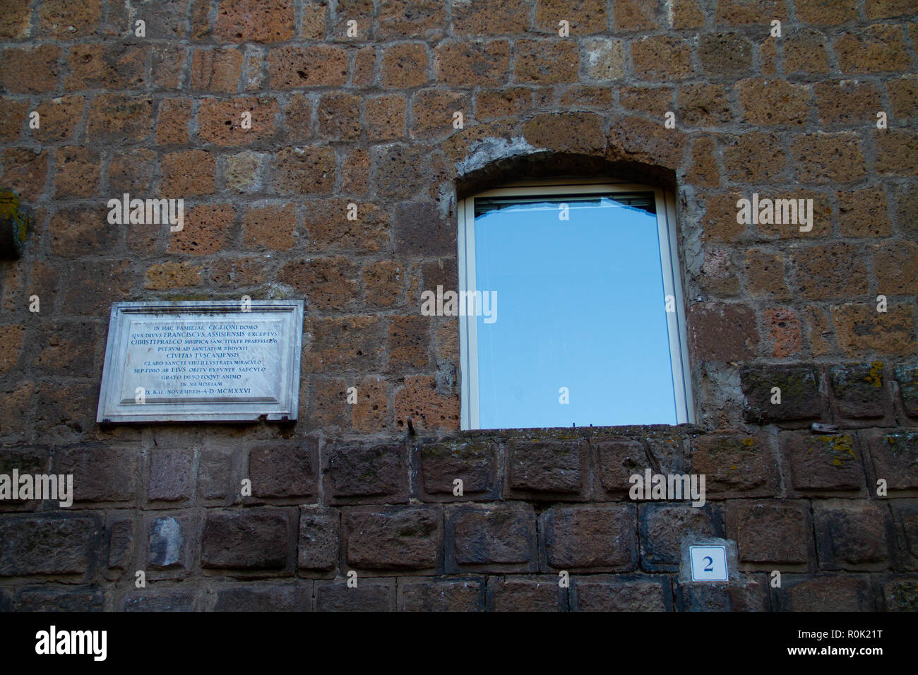 Window and tombstone in an ancient palace in Viterbo Stock Photo - Alamy