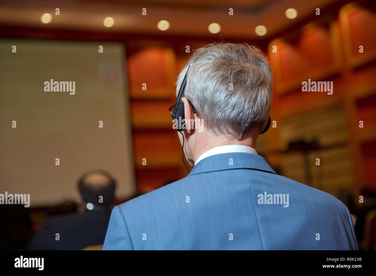 bald security guard with the headset to control people . heated debate ...
