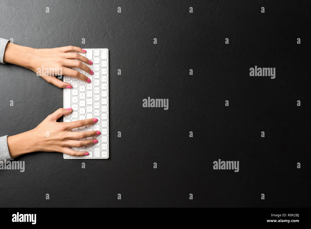 Woman using computer keyboard Stock Photo - Alamy