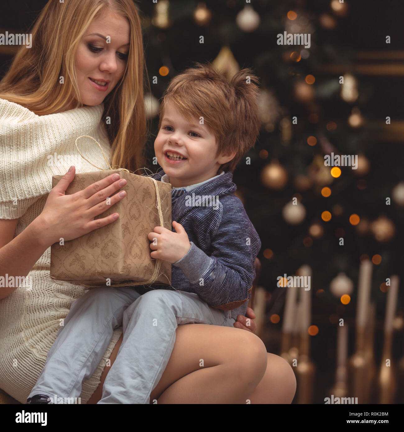 Sitting girl with boy on her lap hi-res stock photography and images ...