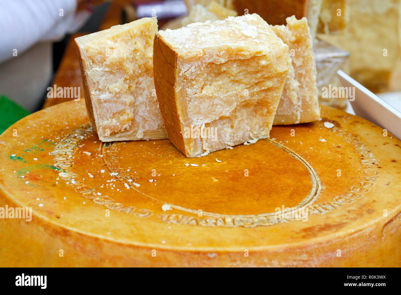 Big pieces of famous Italian parmesan cheese sold on market Stock Photo ...