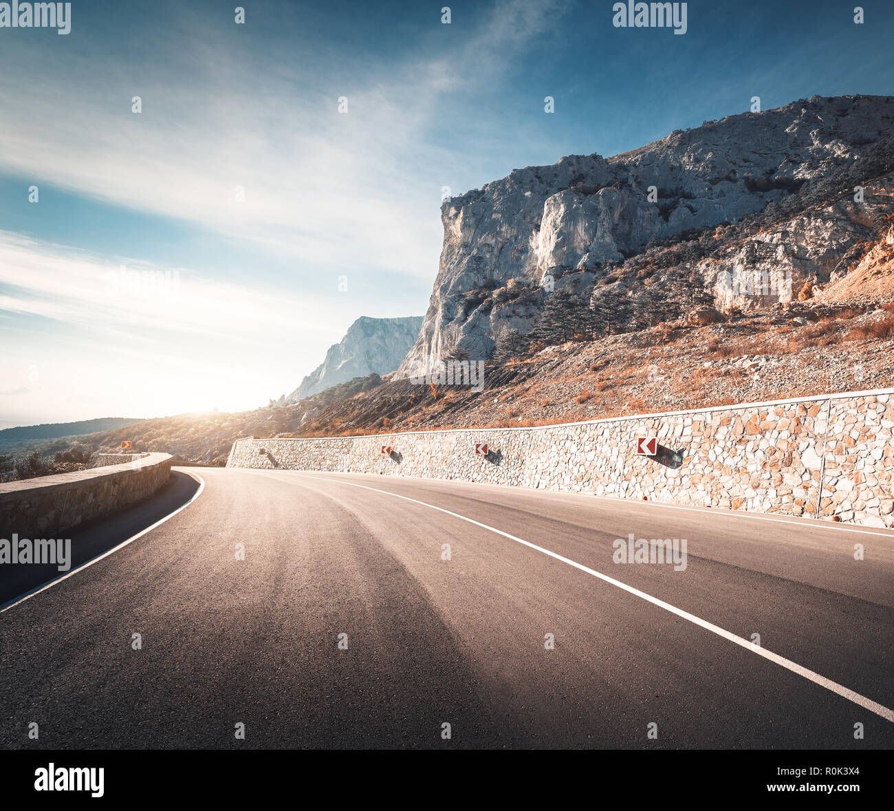 Mountain road and beautiful sky at sunset. Colorful landscape with high ...