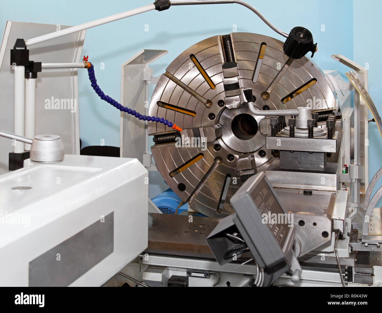 Rotating head at CNC lathe in workshop Stock Photo - Alamy