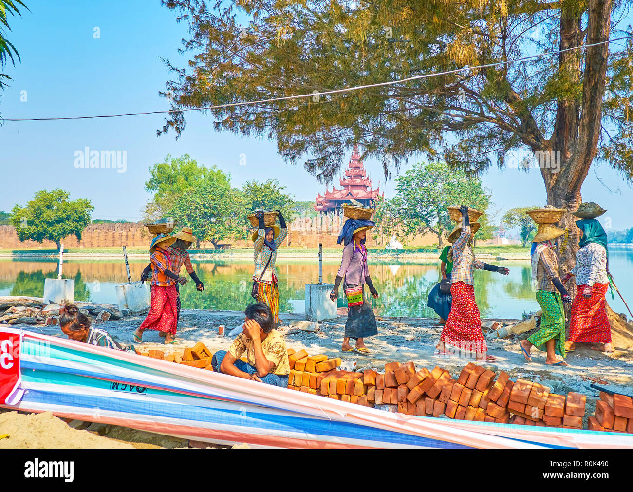 Construction workers carry stones hi-res stock photography and images ...