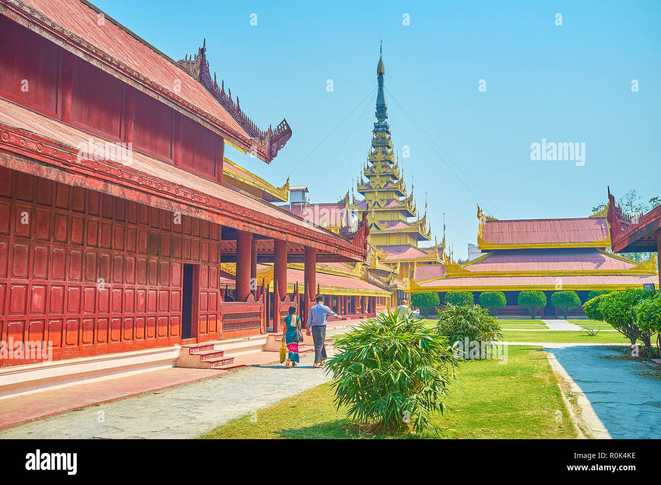 The tourists walk along The Chief Queens Apartments of the Royal Palace ...