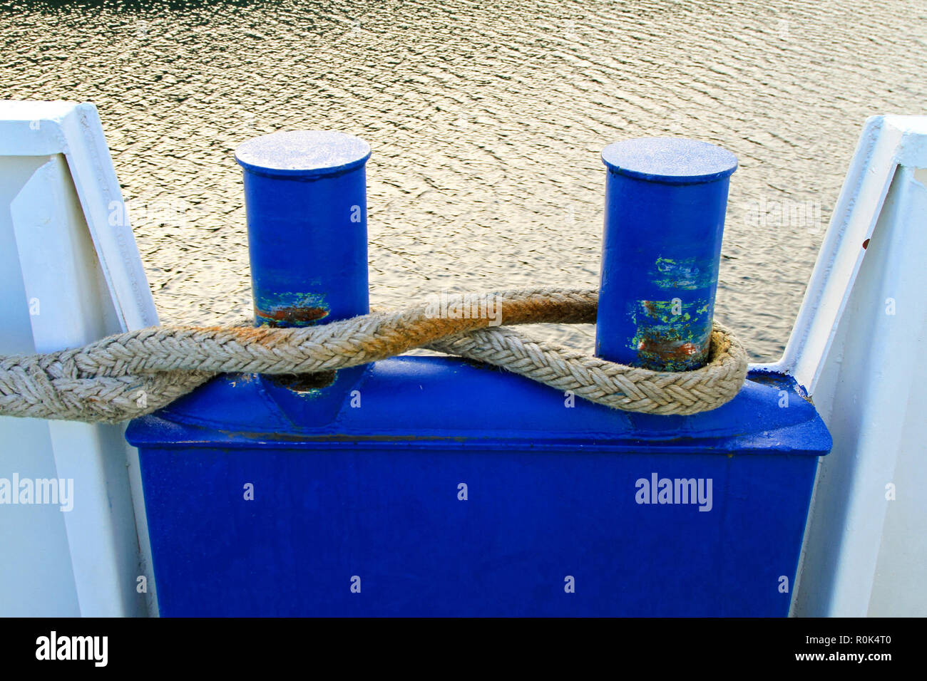 Tied safety rope for ferry boat anchor Stock Photo - Alamy