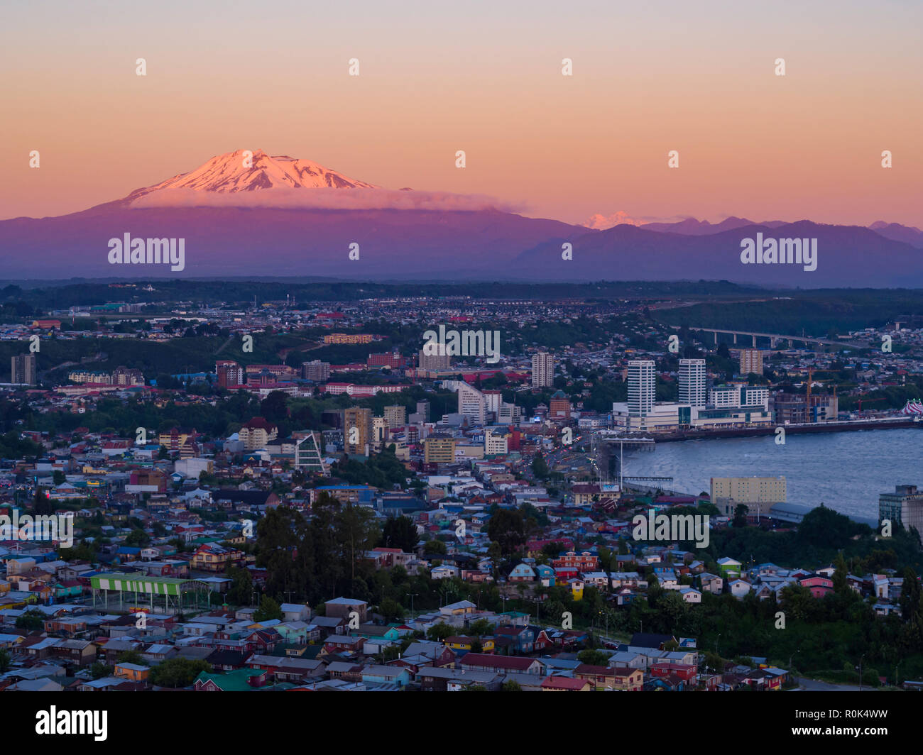Aerial view of the city of Puerto Montt at dusk, the Osorno and Calbuco ...