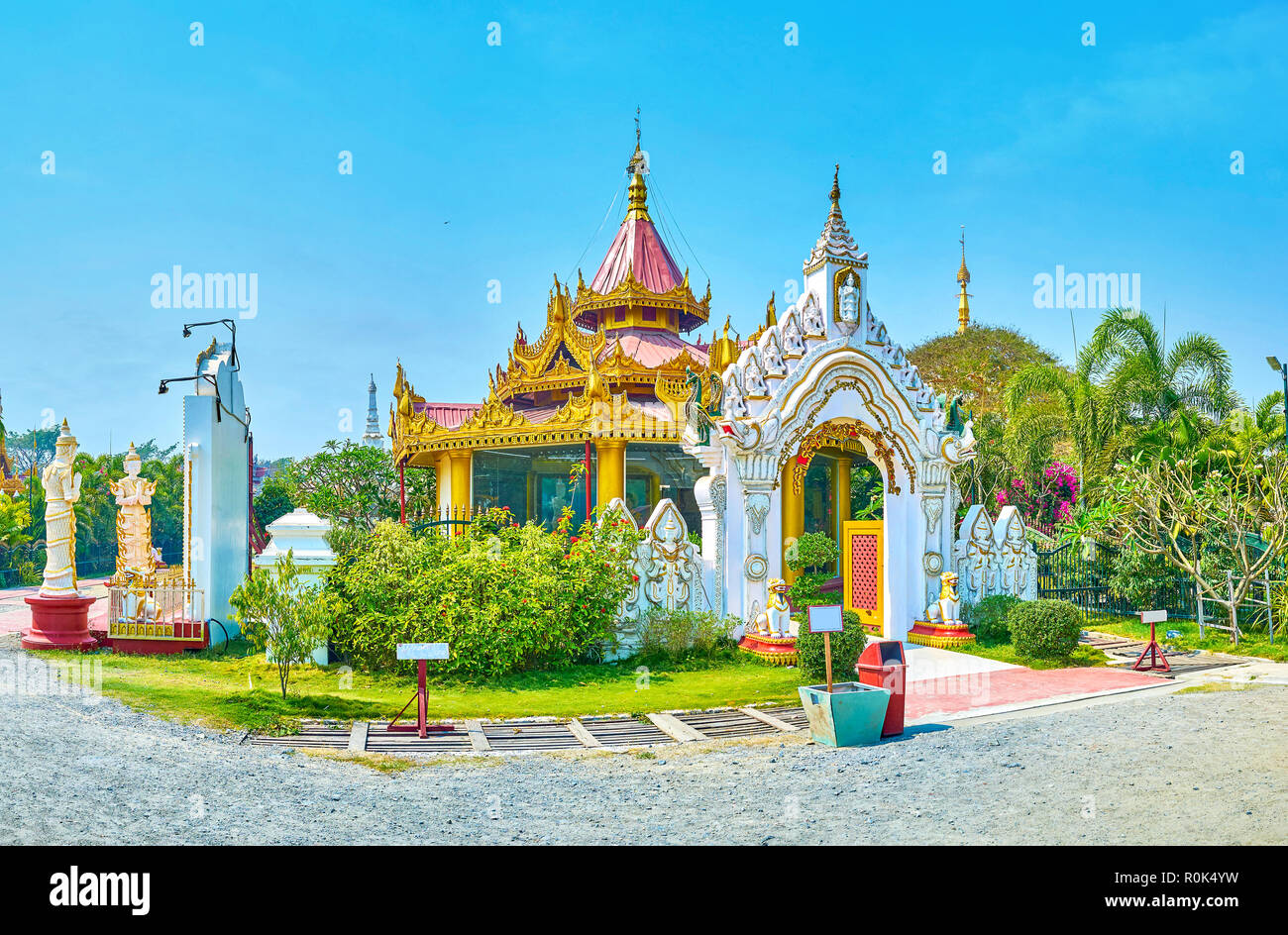 The small decorated pavilion with sculptures of King Mindon surrounded ...