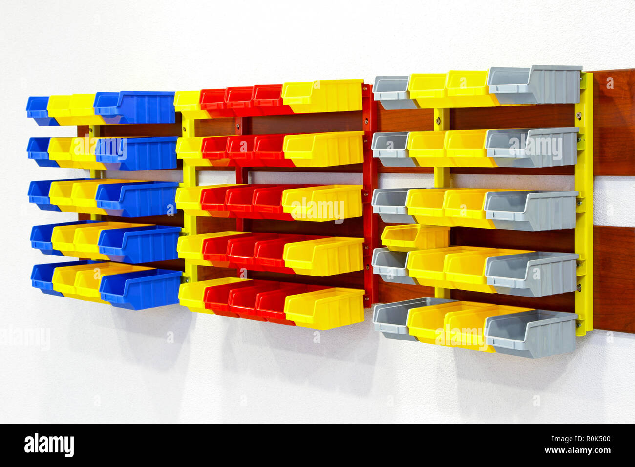 Open plastic boxes wall shelves in storehouse Stock Photo - Alamy