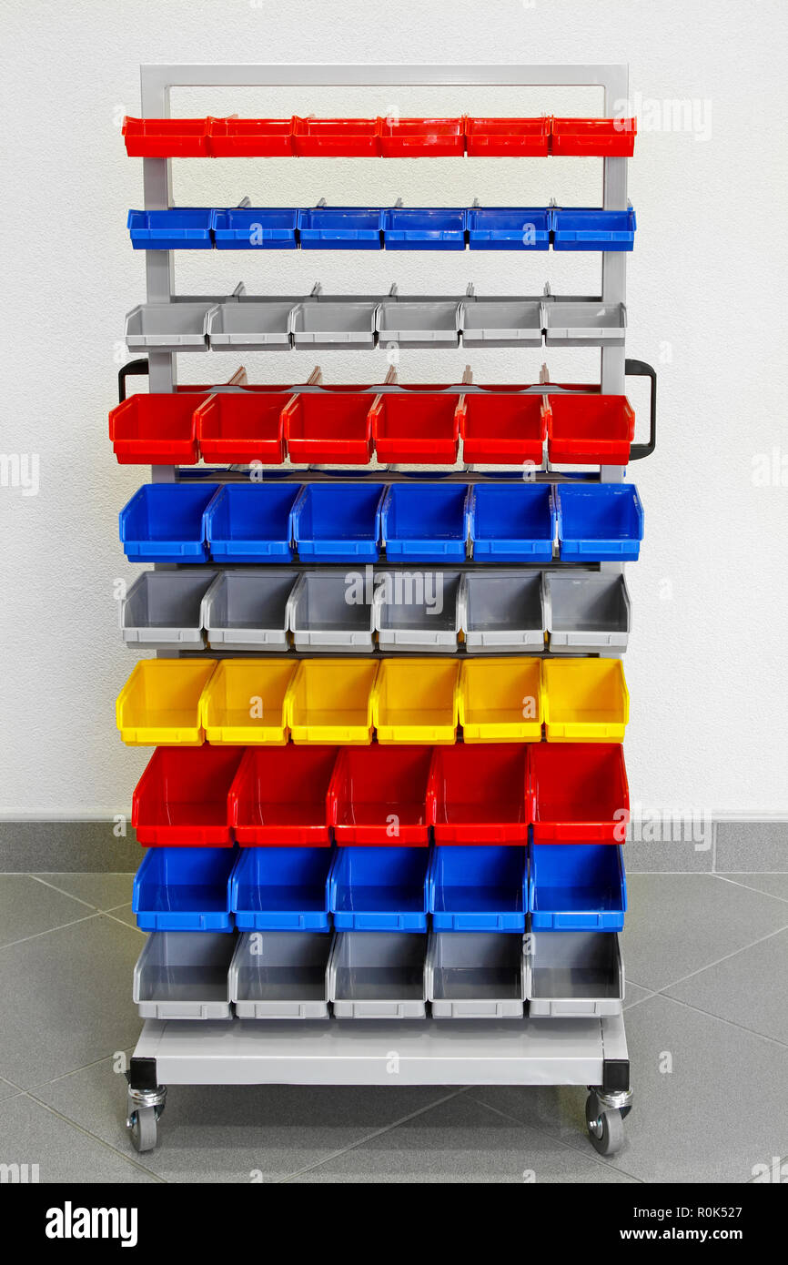 Trolley with colorful plastic shelves for workshop Stock Photo - Alamy