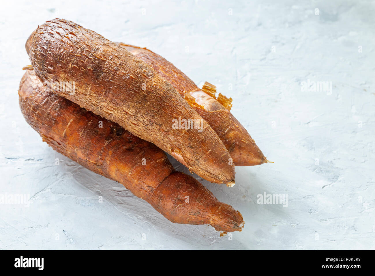 Raw yucca starch on the wooden table - Manihot esculenta Stock Photo ...