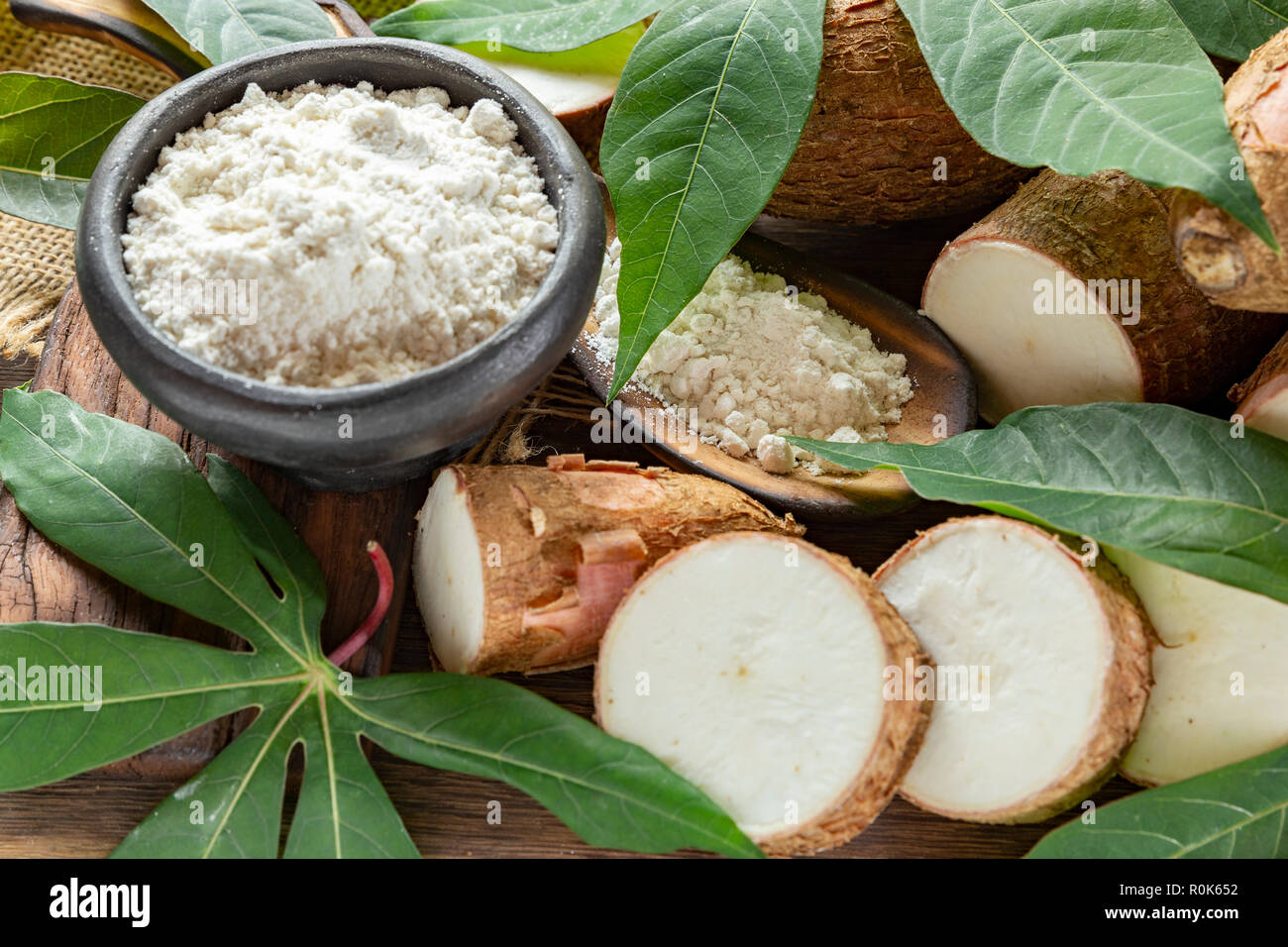 Raw yucca starch on the wooden table - Manihot esculenta Stock Photo ...