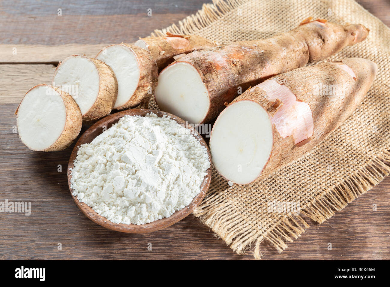 Raw yucca starch on the wooden table - Manihot esculenta Stock Photo ...
