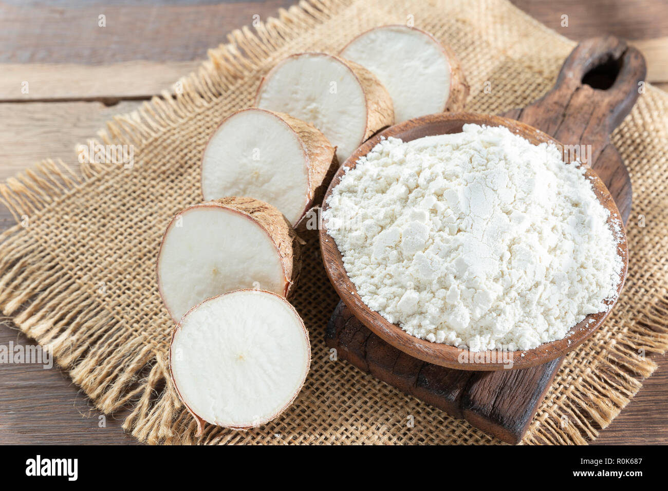 Raw yucca starch on the wooden table - Manihot esculenta Stock Photo ...