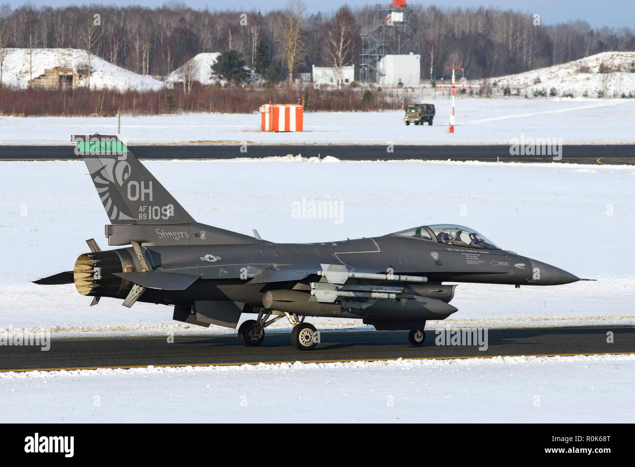 An F-16 from the 180th Fighter Wing, taxiing on the runway at Amari Air ...