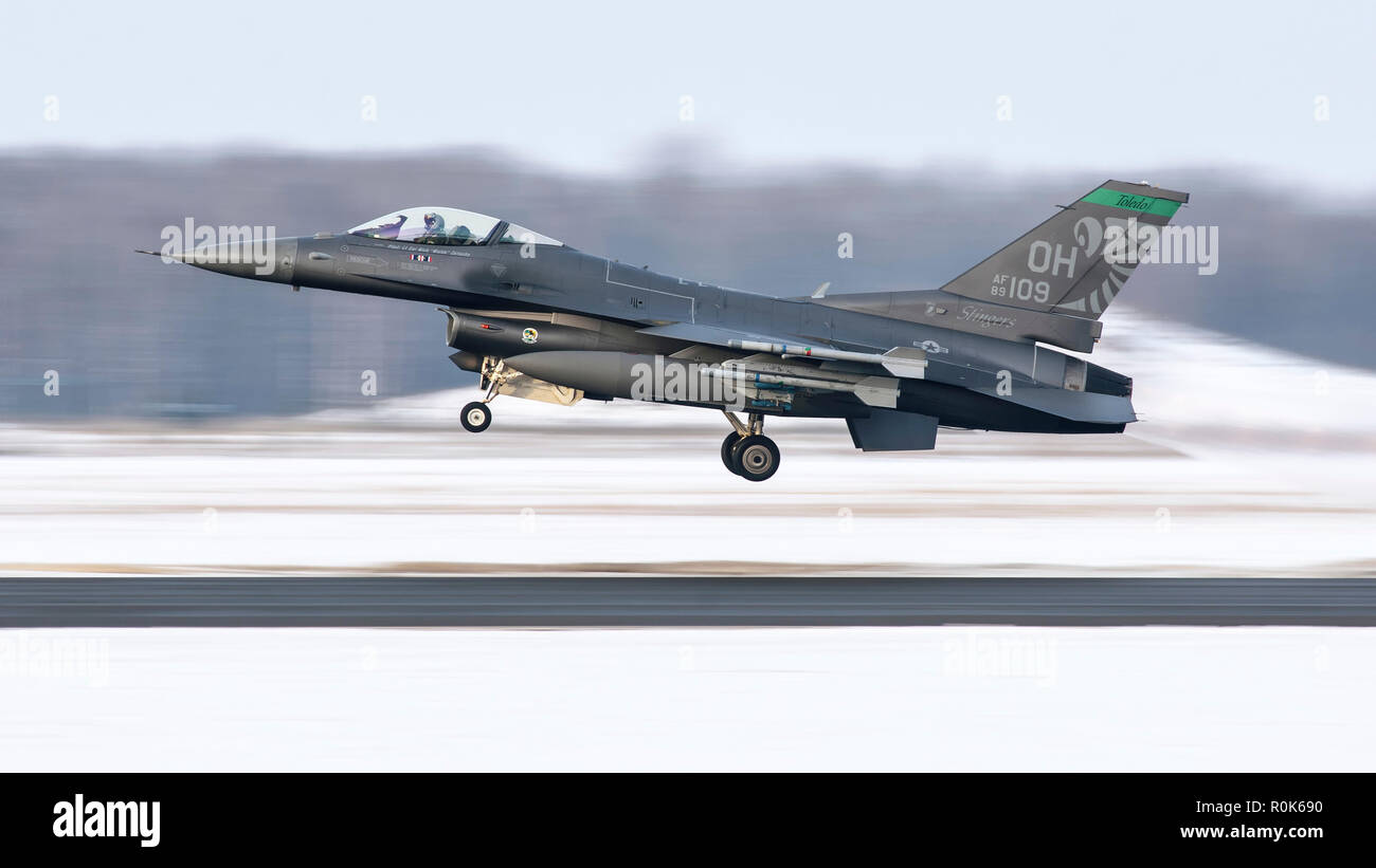An F-16 from the 180th Fighter Wing, taking off from Amari Air Base ...