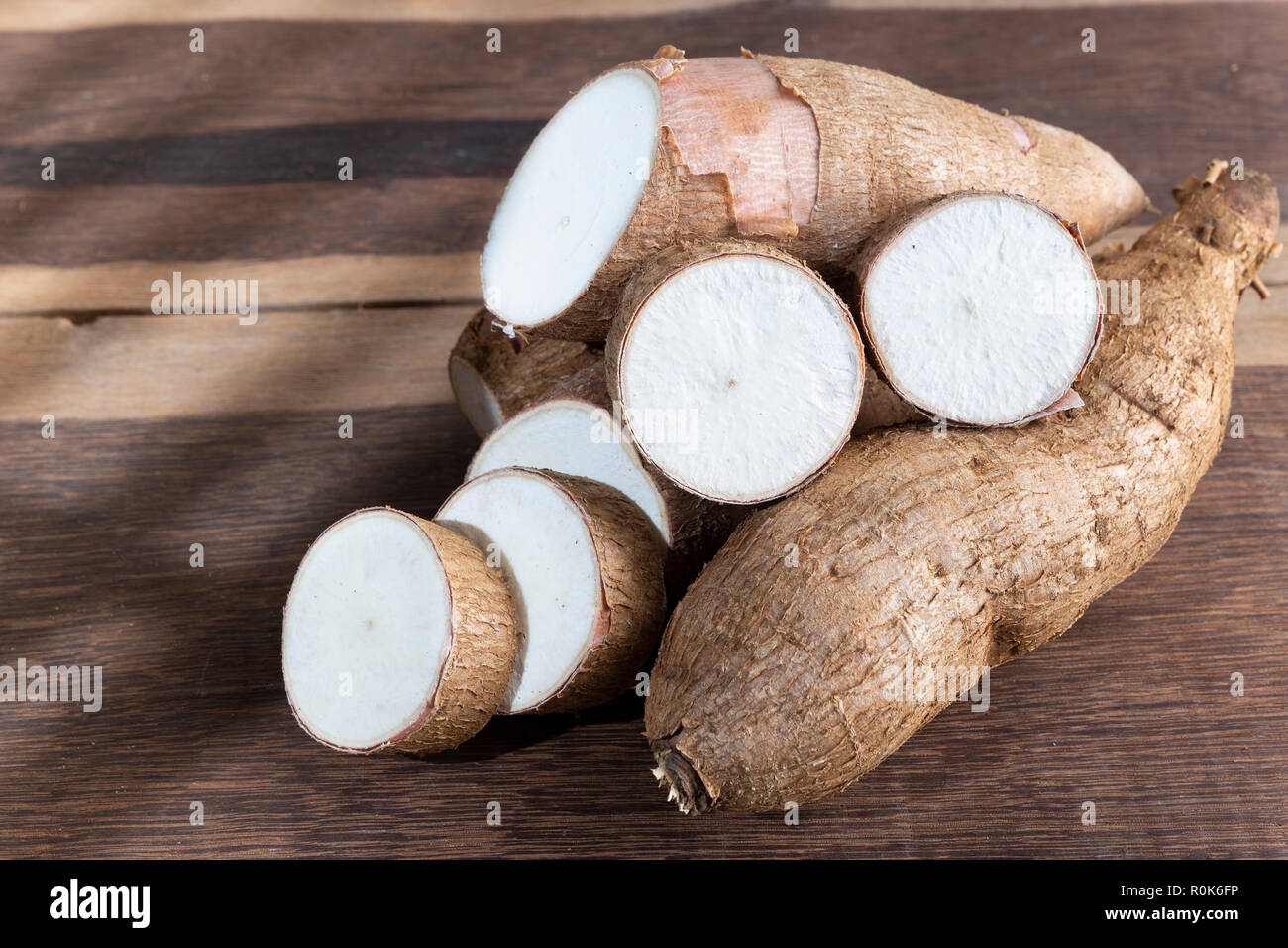 Raw yucca starch on the wooden table - Manihot esculenta Stock Photo ...